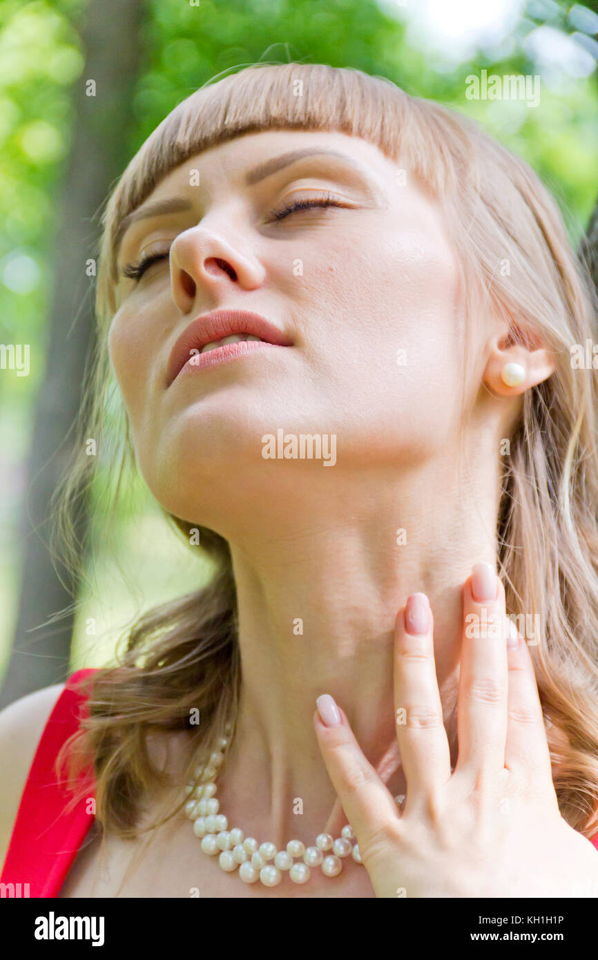Vertical portrait of beautiful girl with closed eyes on green ...