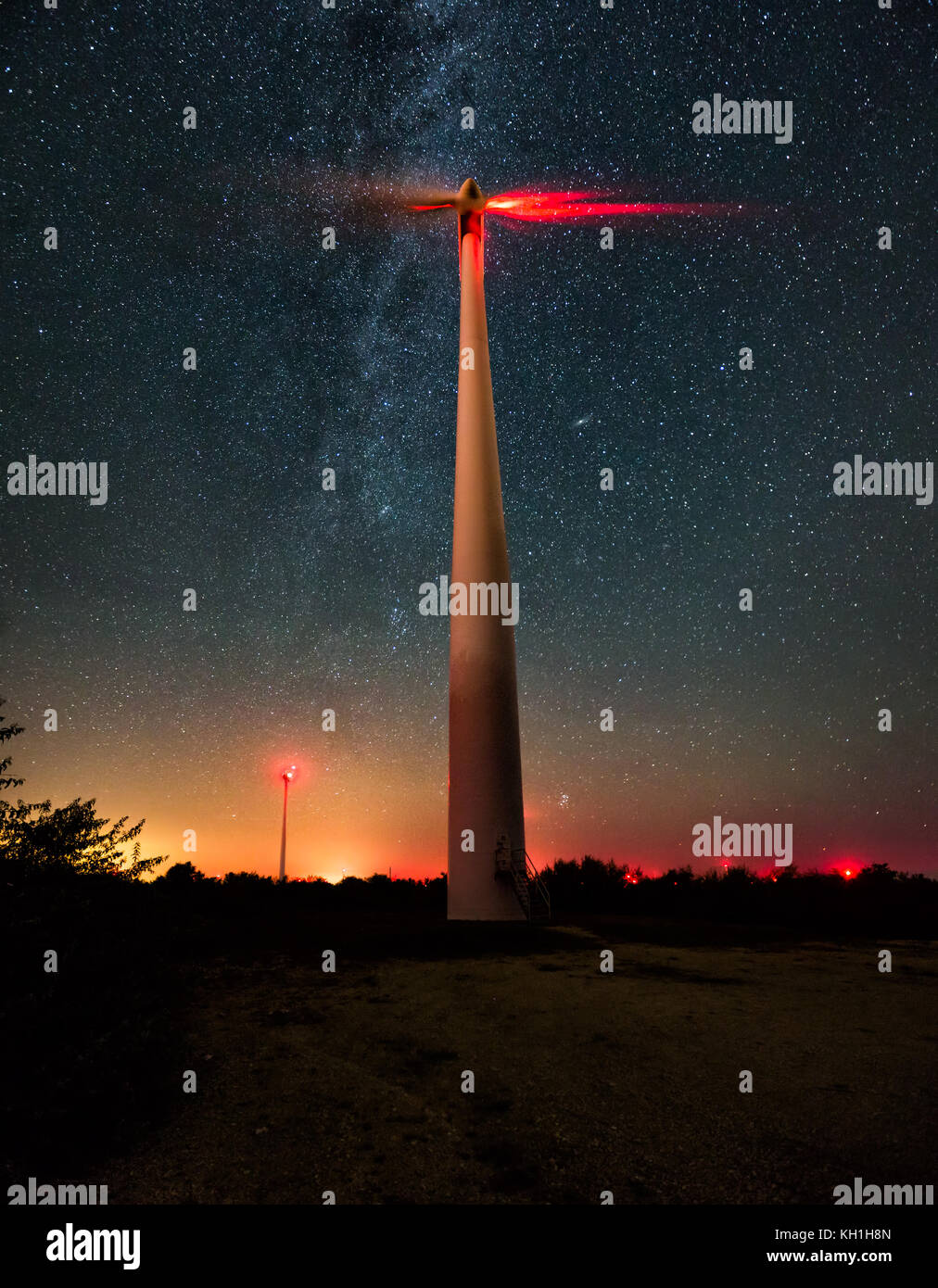Wind turbines on the starry night sky with milkyway Stock Photo - Alamy