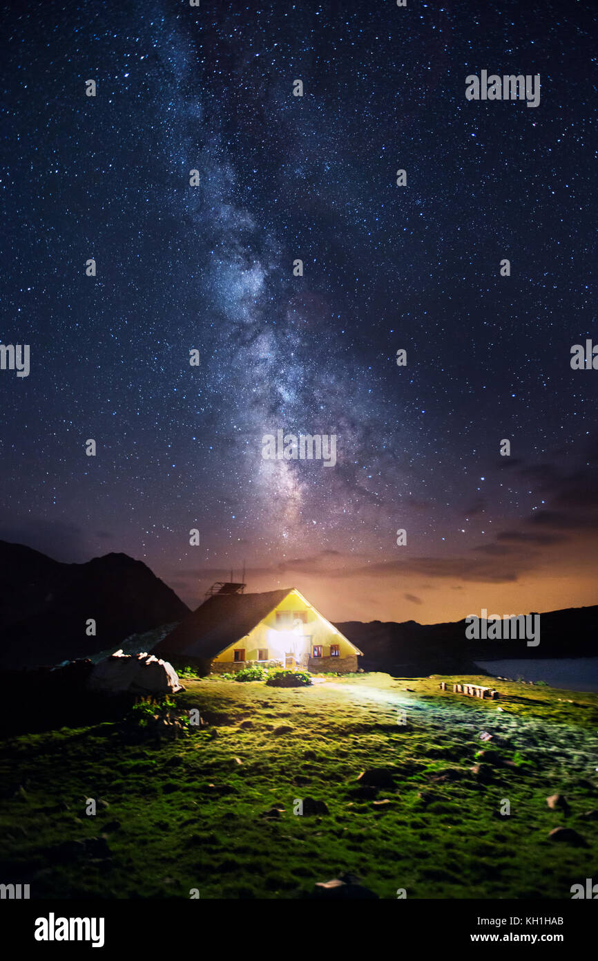 Hut in the mountains at night under the stars Stock Photo - Alamy
