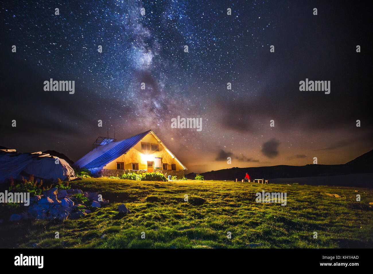 Hut in the mountains at night under the stars Stock Photo - Alamy