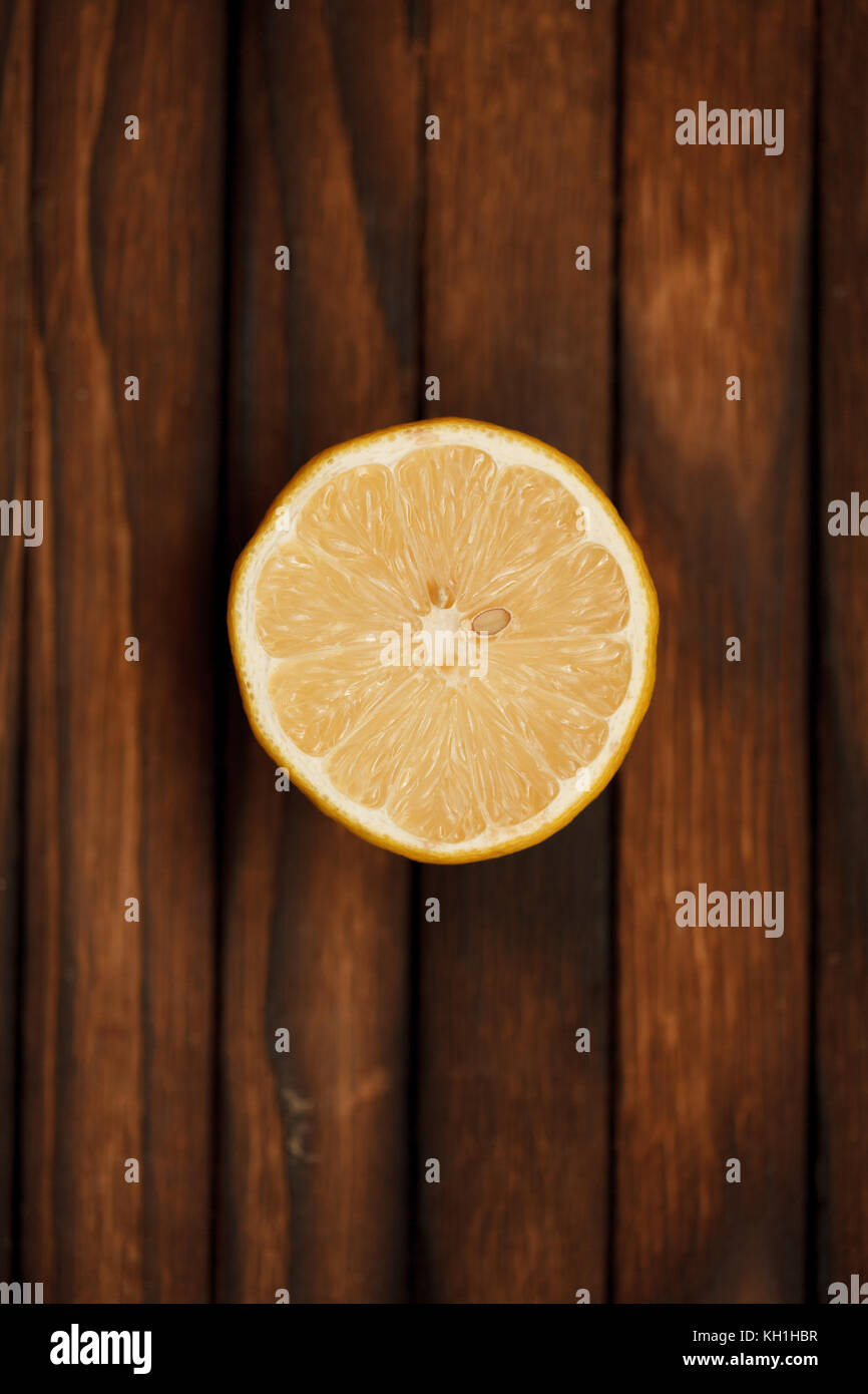 lemon on wooden table Stock Photo - Alamy