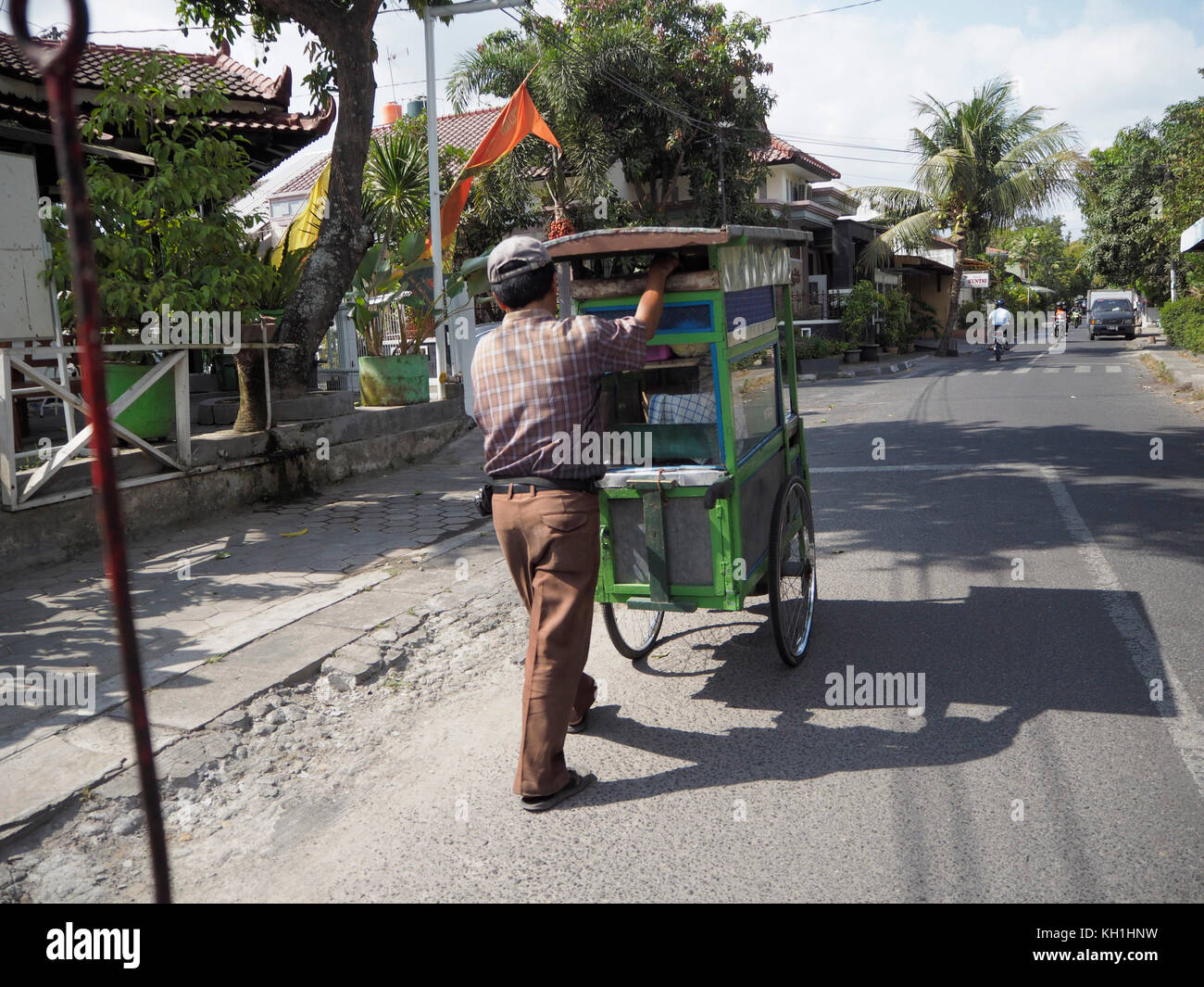 Hawker pushing food cart in Jogjakarta, Central Java, Indonesia Stock ...