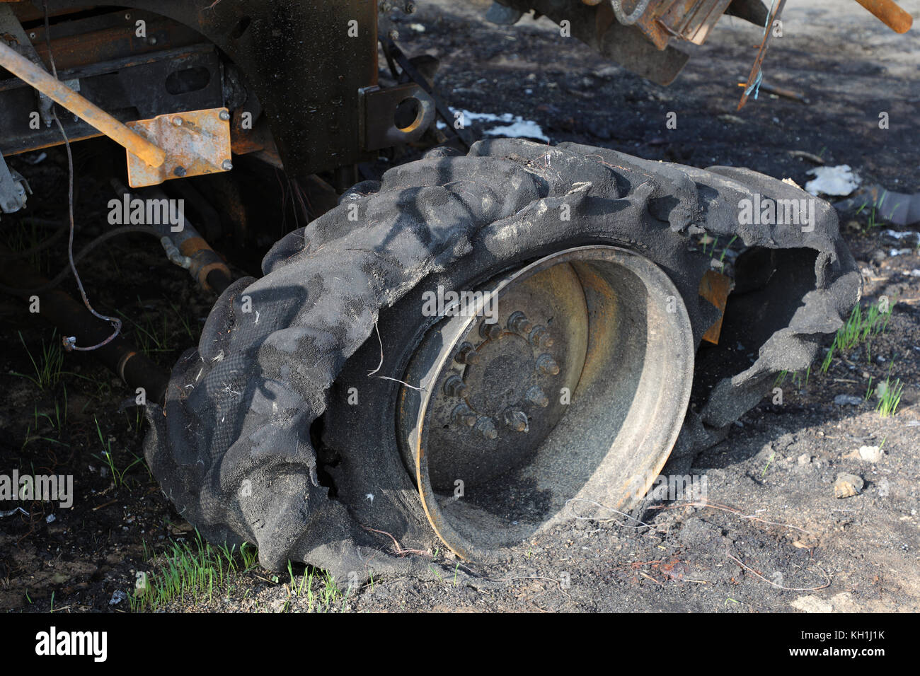 Closeup of combine harvester destroyed by fire Stock Photo - Alamy
