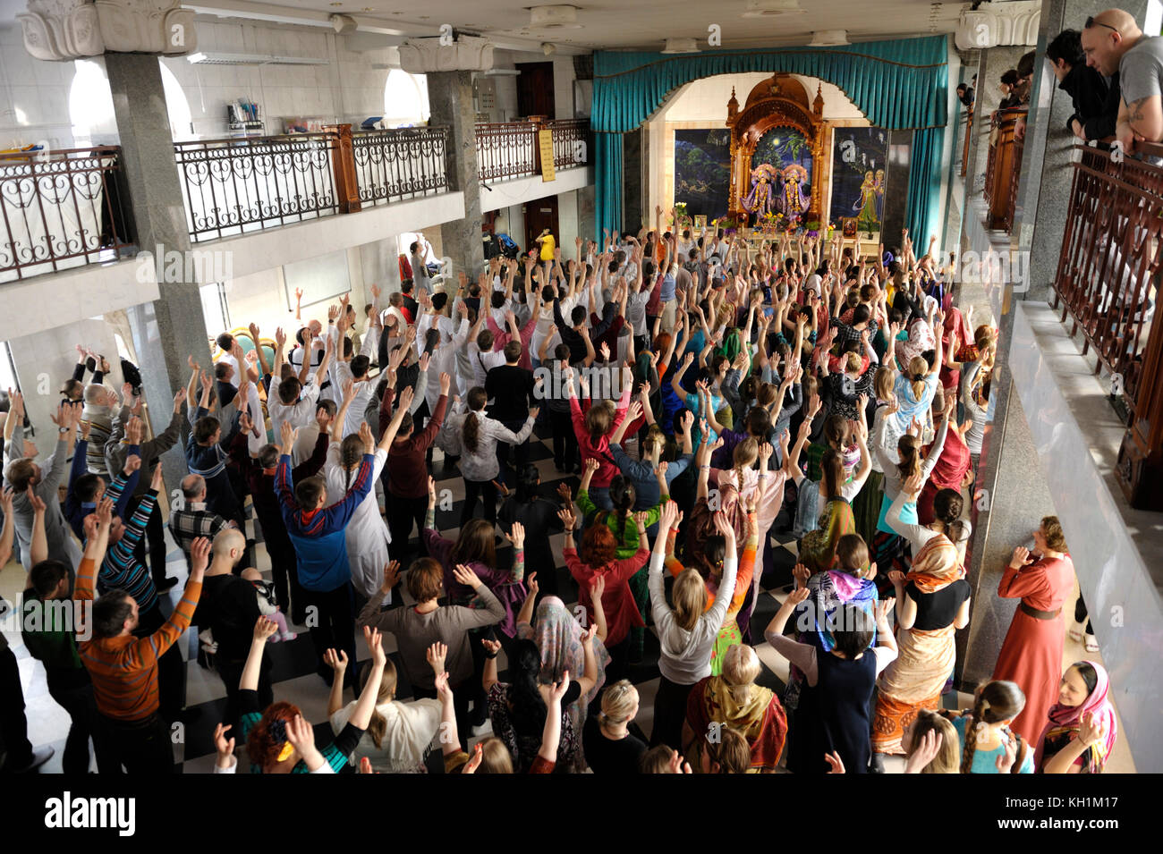 Hare Krishnas praying in a temple, their hands up. April 3, 2017. The ...