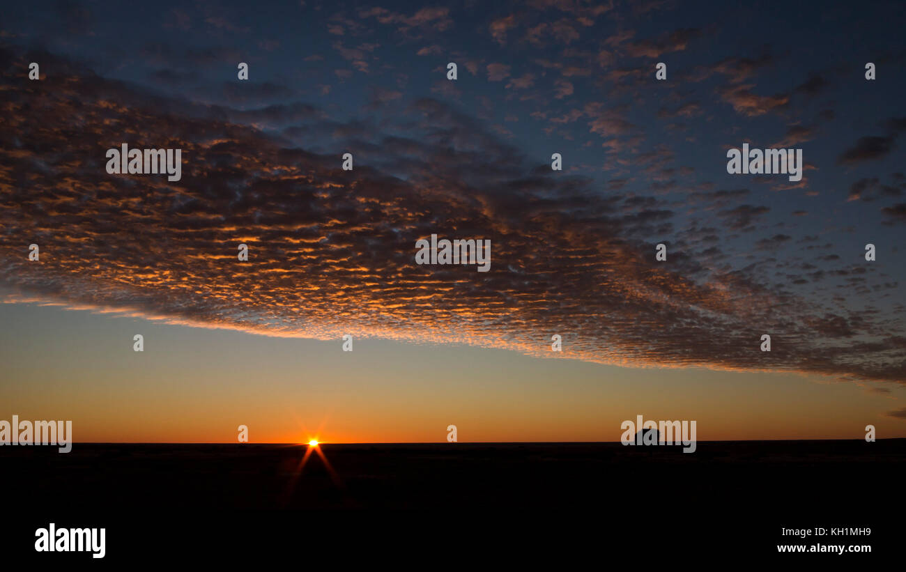 Sun Rise with reflections off a cloud formation Stock Photo - Alamy
