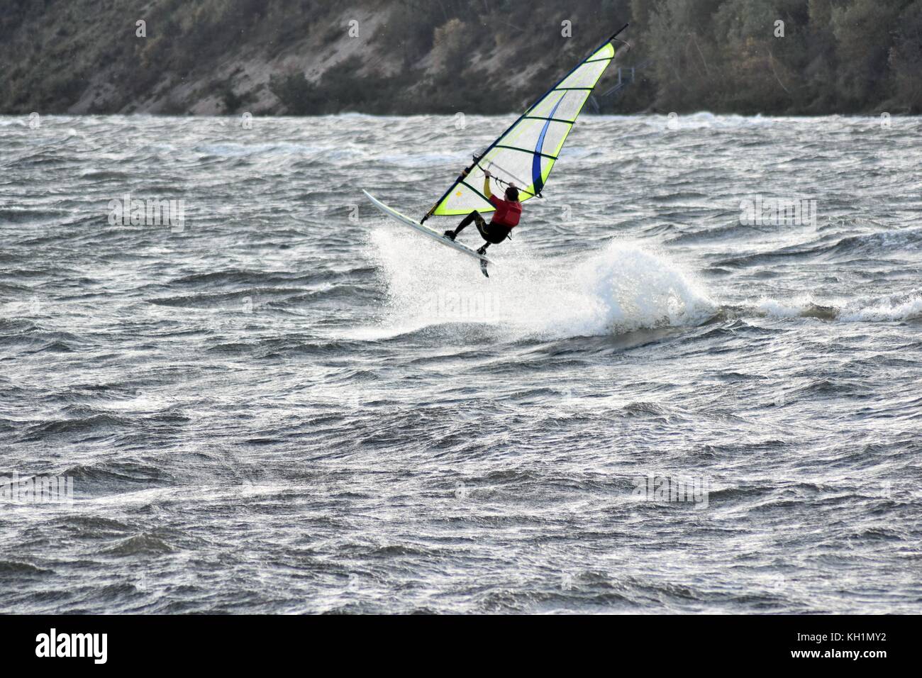 Dynamic shot of windsurfer jumping on stormy waves of Baltic sea Stock ...