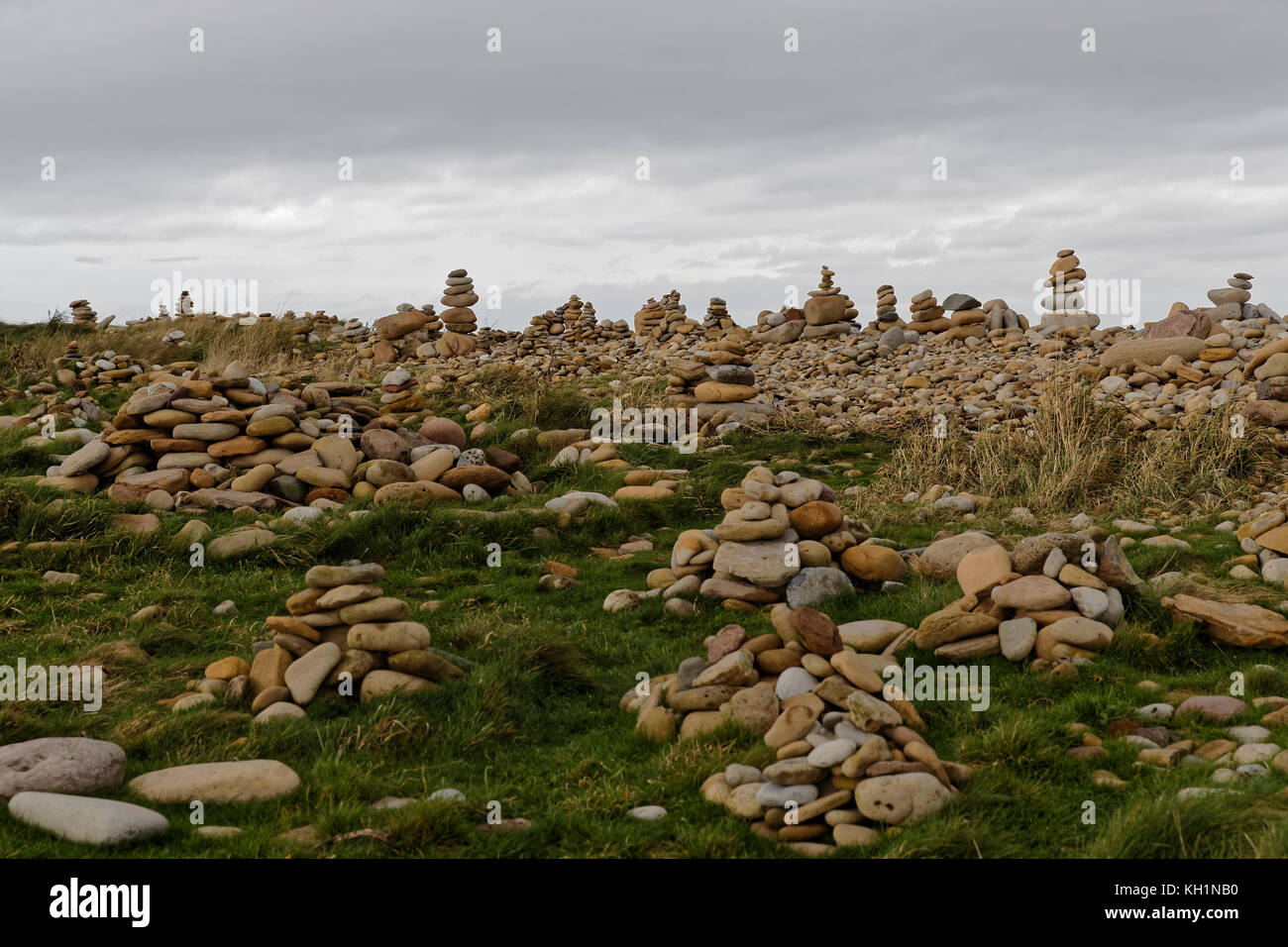 Man made stacks of stone / cairns - lining the east beach of Holy ...