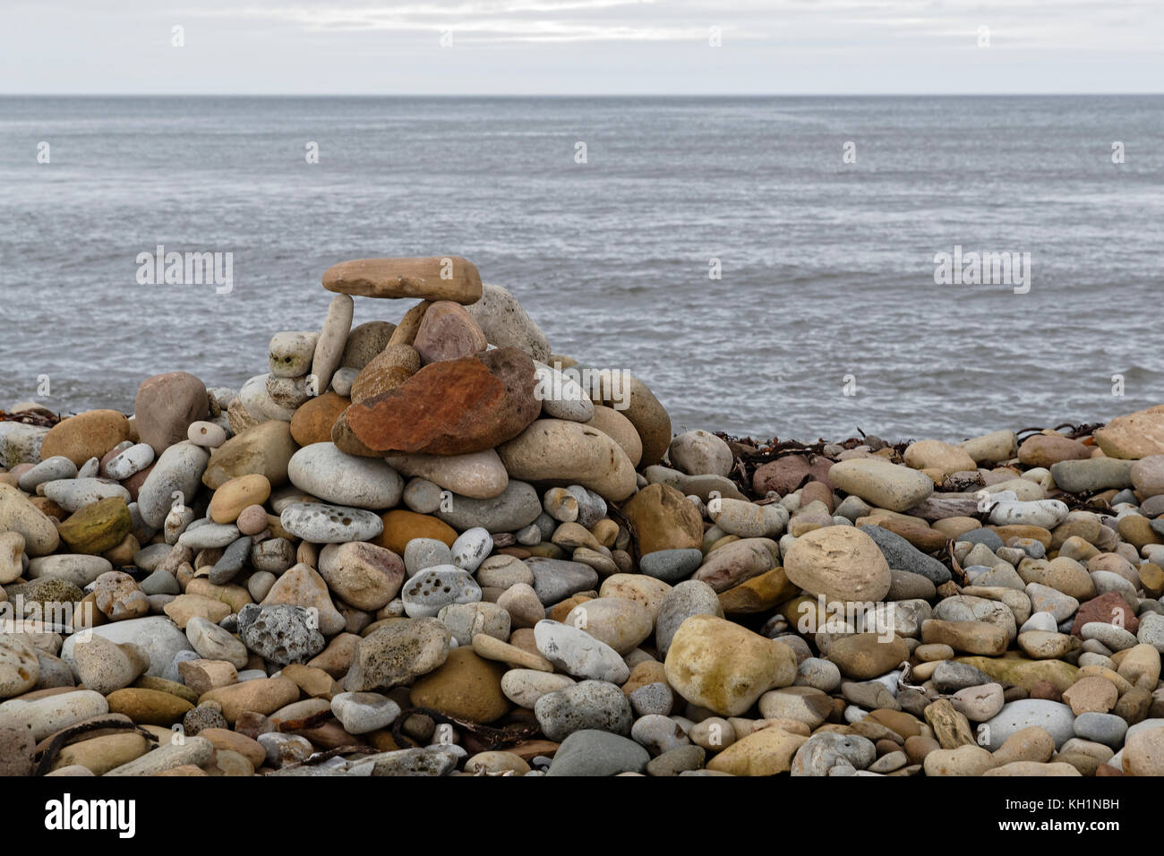 Man made stacks of stone / cairns - lining the east beach of Holy ...