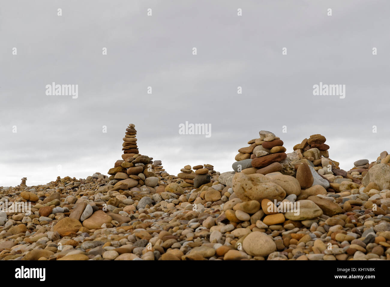 Man made stacks of stone / cairns - lining the east beach of Holy ...