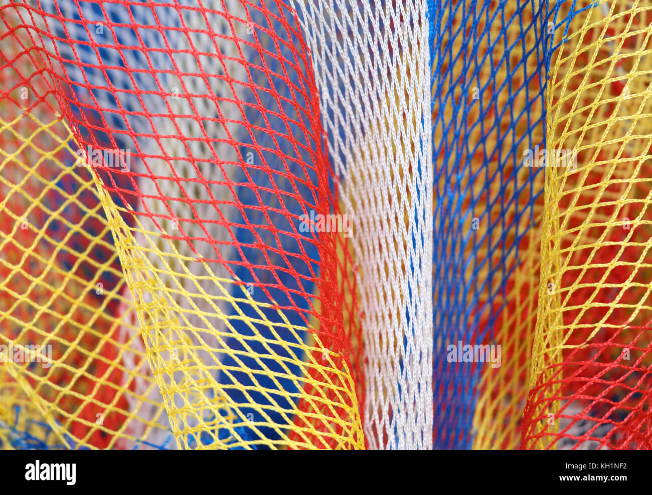 colored background of a net of a toy fishing net Stock Photo - Alamy