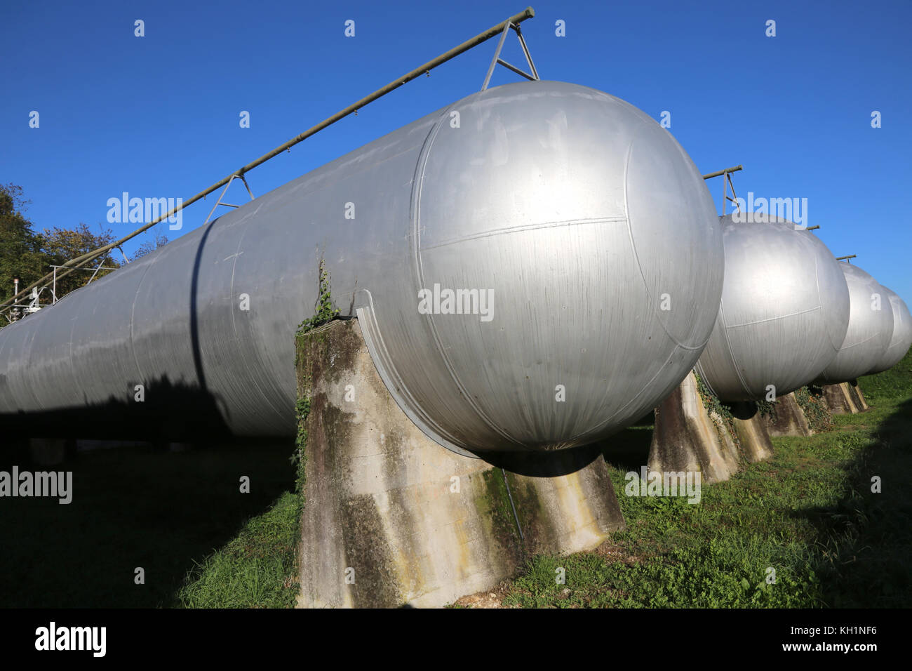 many huge tanks for the storage of methane gas in an industrial zone ...
