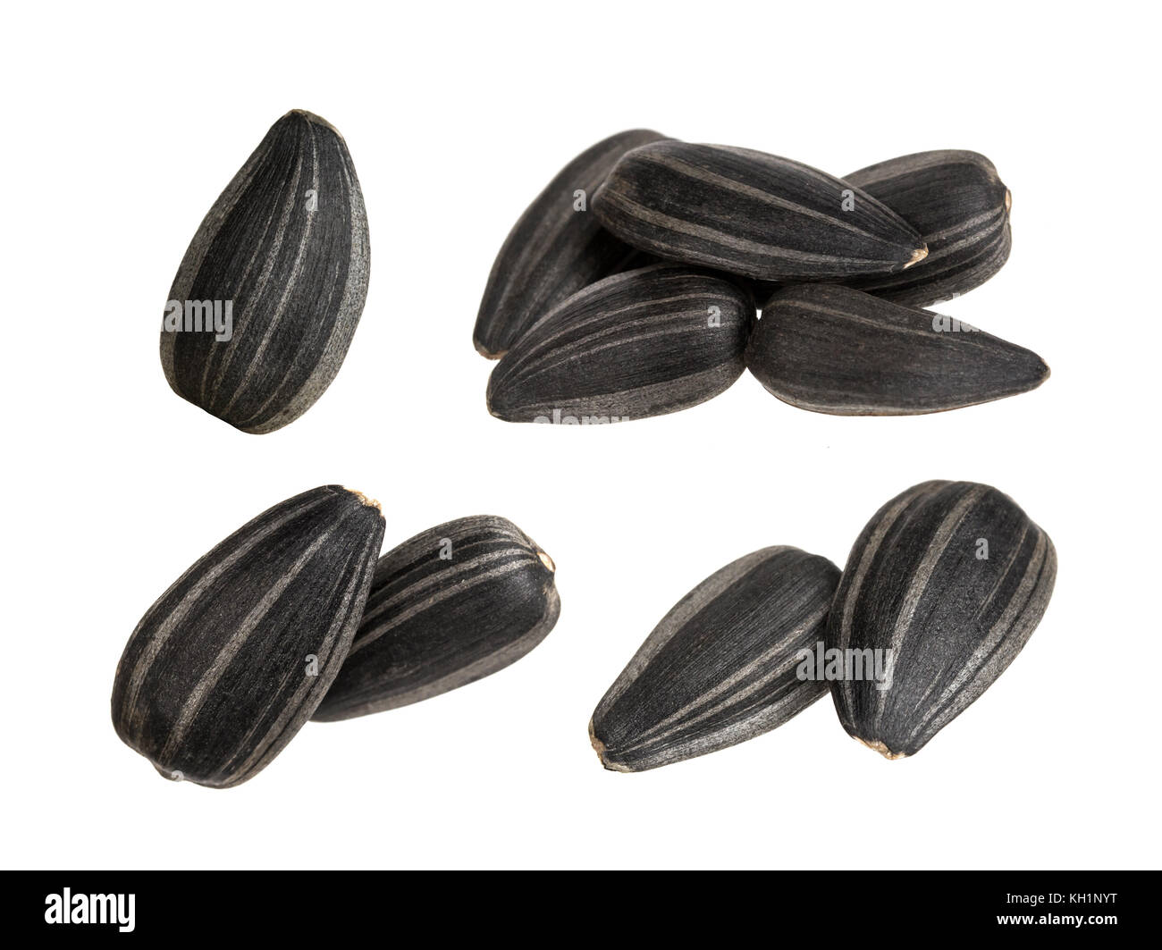 Close-up of black sunflower seeds isolated on white background with ...