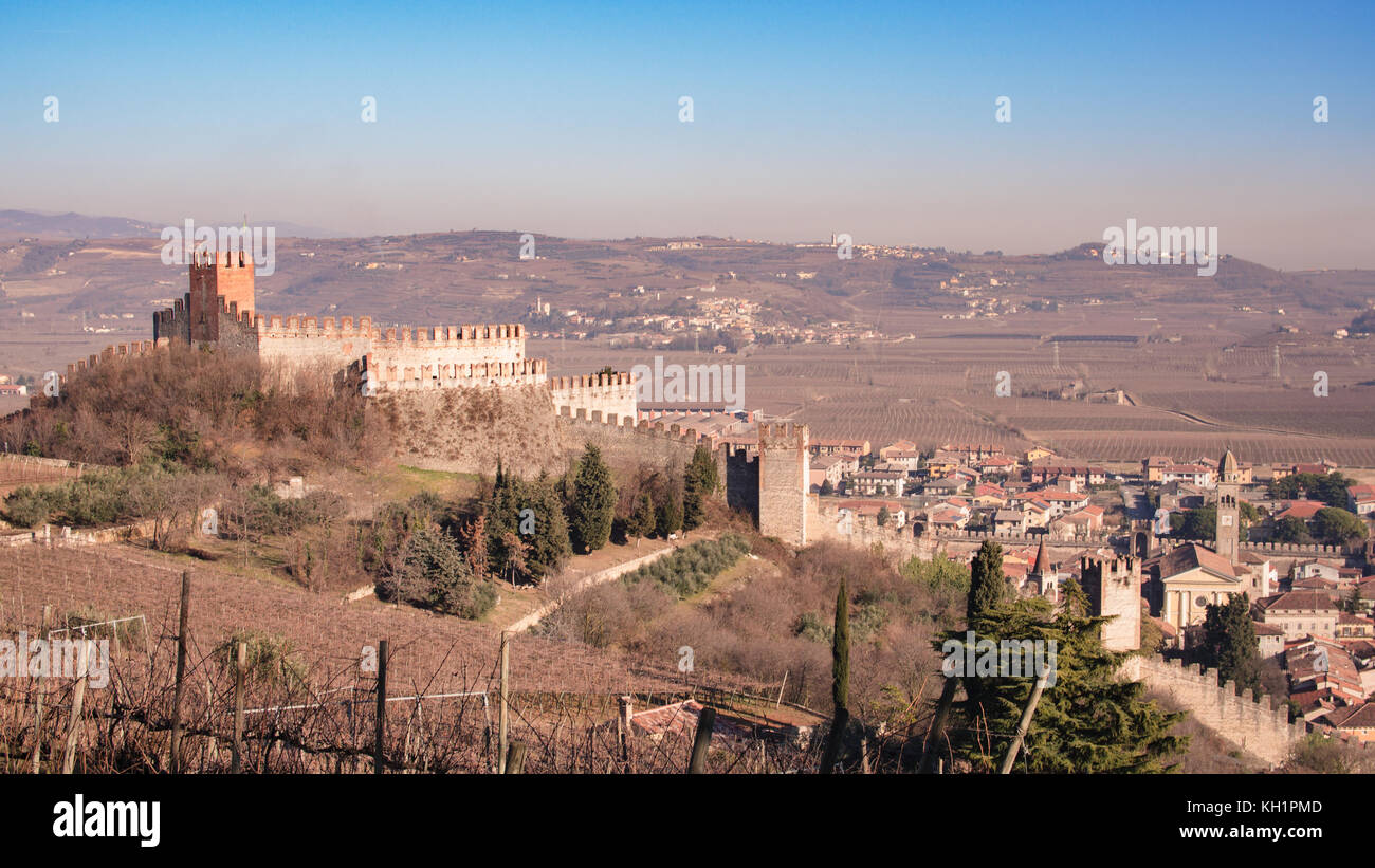 view of Soave (Italy) surrounded by vineyards that produce one of the ...