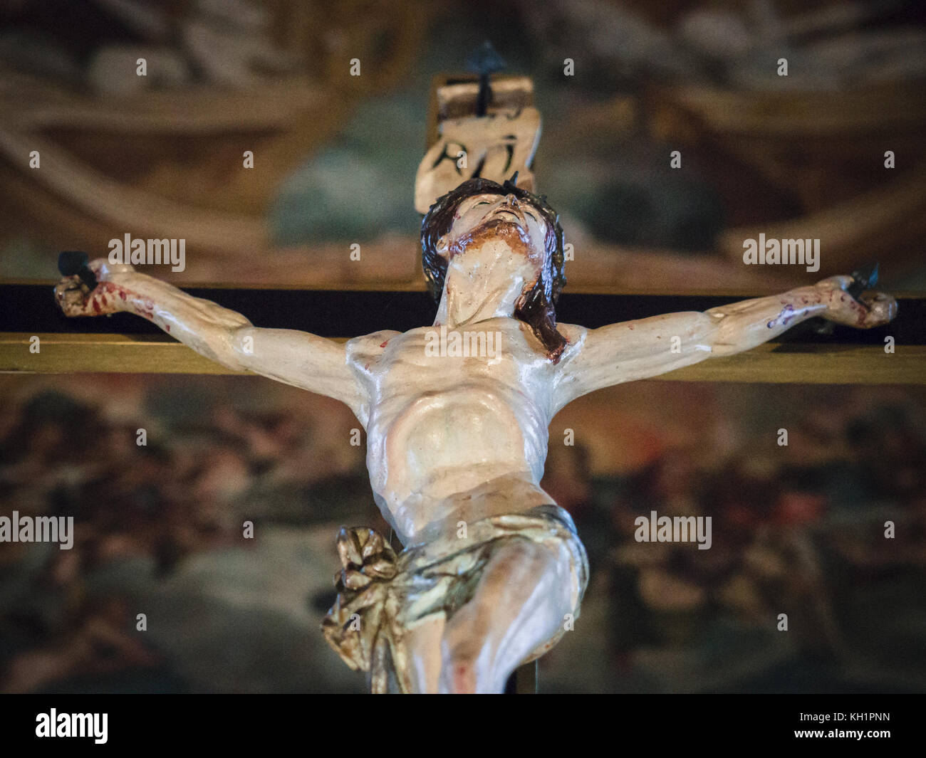 Lonigo, Italy - August 8, 2017: Statue of Jesus crucified in an ancient ...