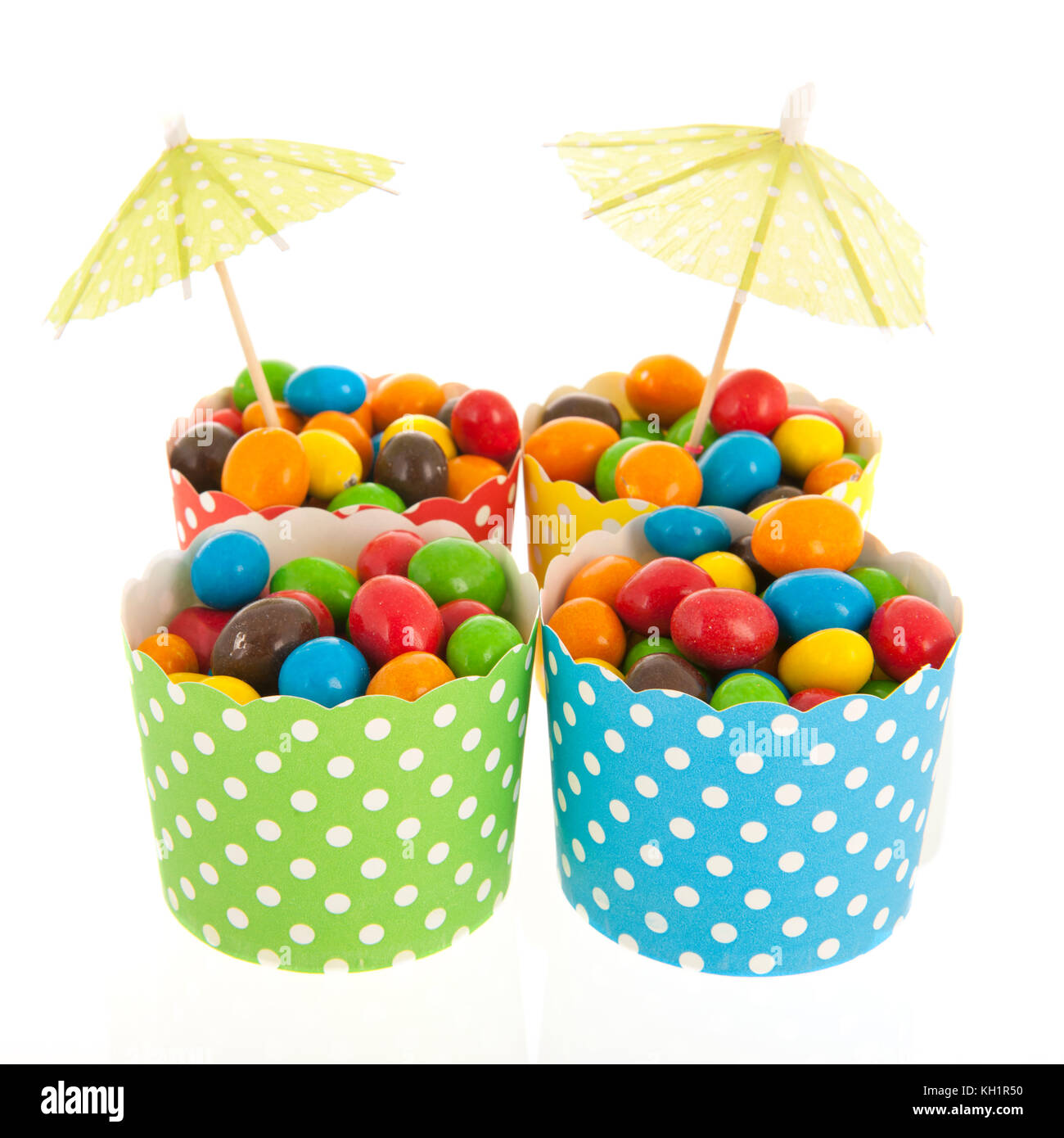 Colorful party candy in cups isolated over white background Stock Photo ...