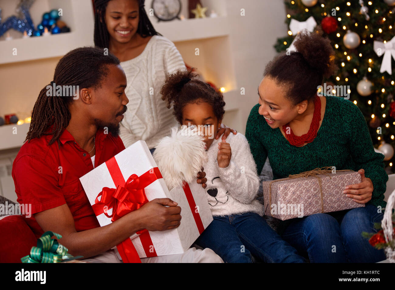 Child getting present christmas hi-res stock photography and images - Alamy