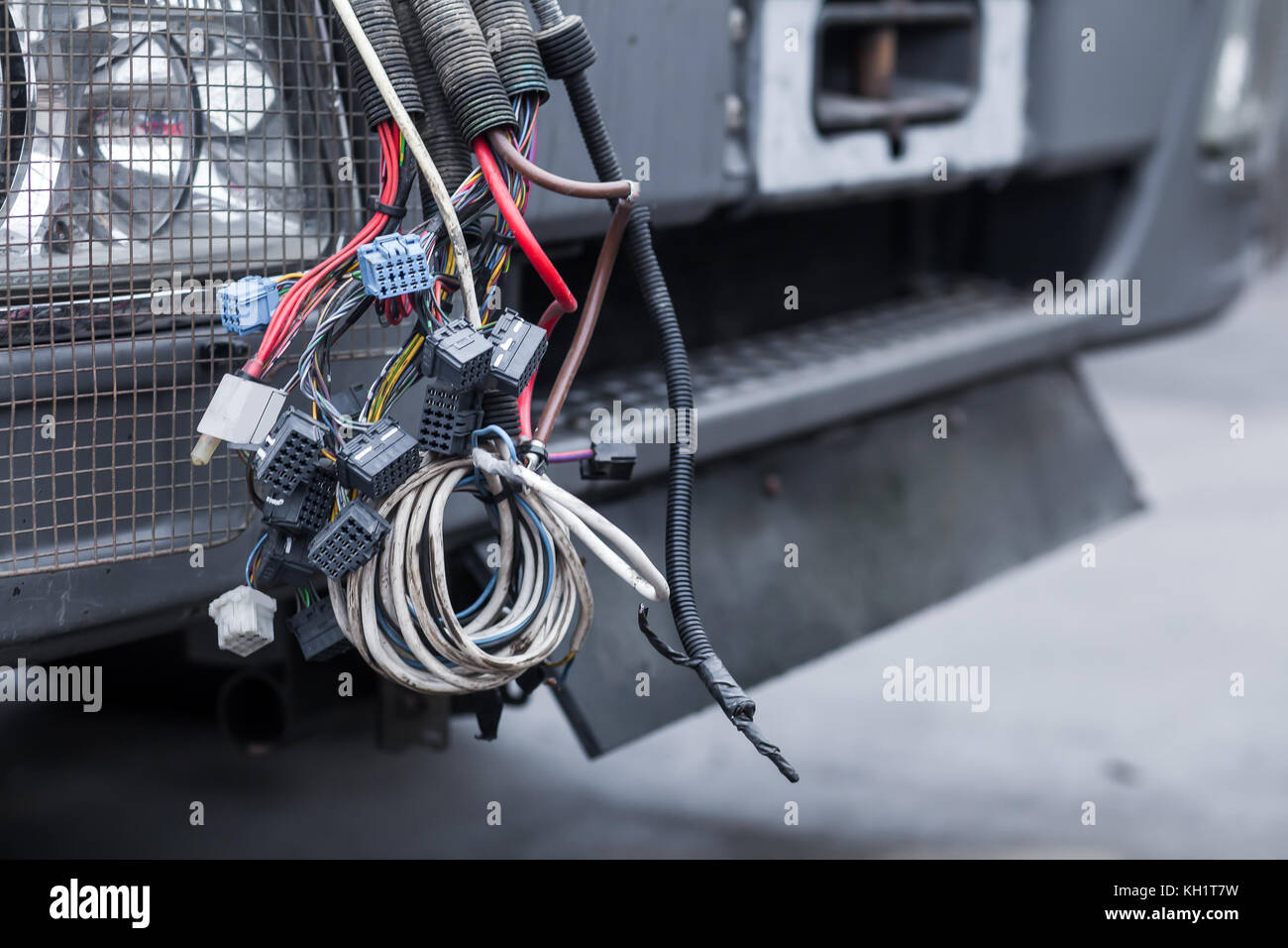 Close-up of a bunch of black wires - wiring a truck against a black ...