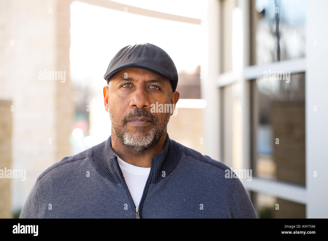 African American man standing alone looking sad Stock Photo - Alamy