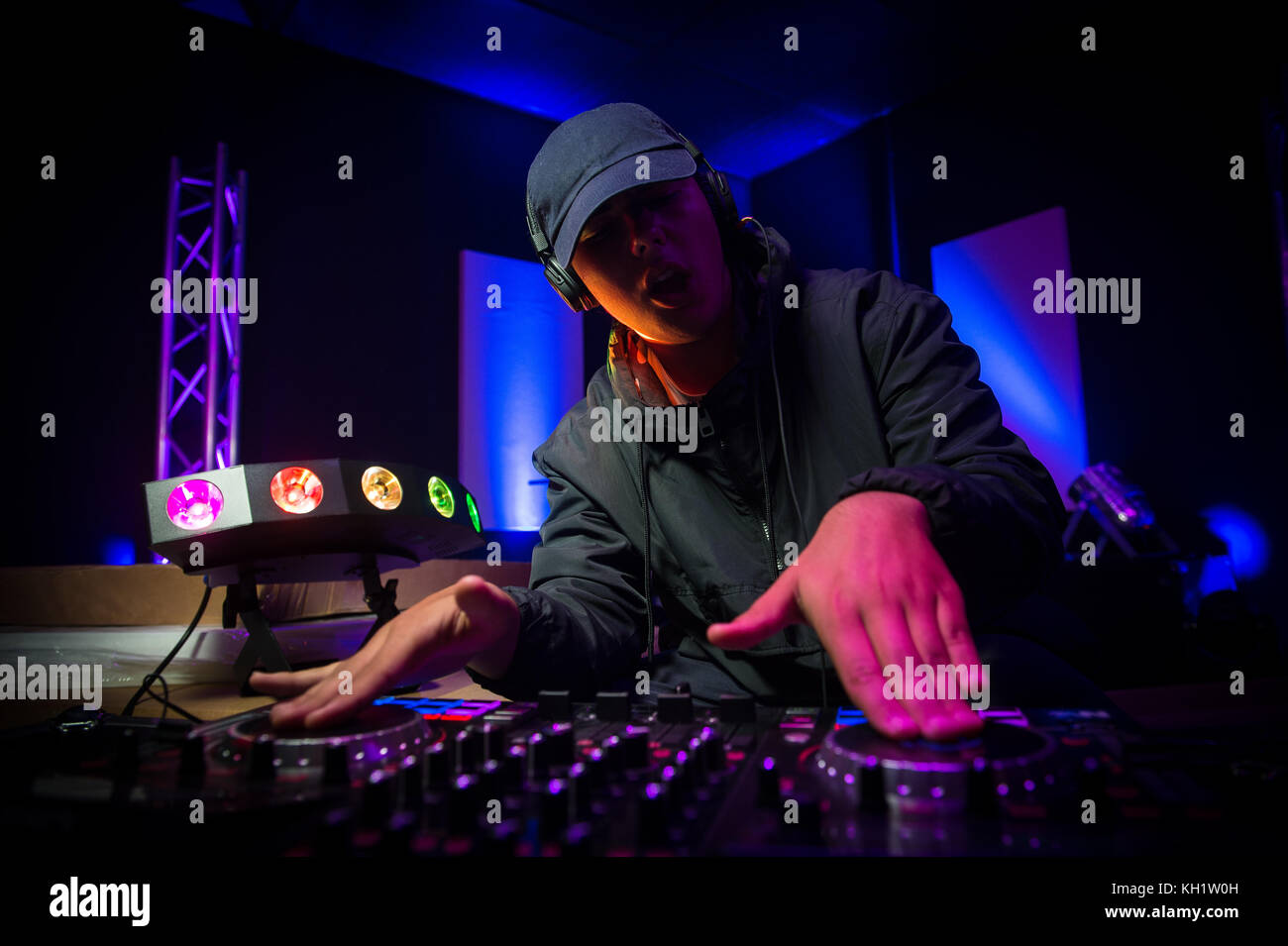 Disc jockey at the turntable dj plays on the best famous cd players at ...