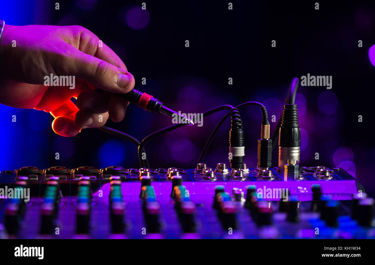 Audio jack Dj mixer dj mix music on the console the dj s hand , france ...