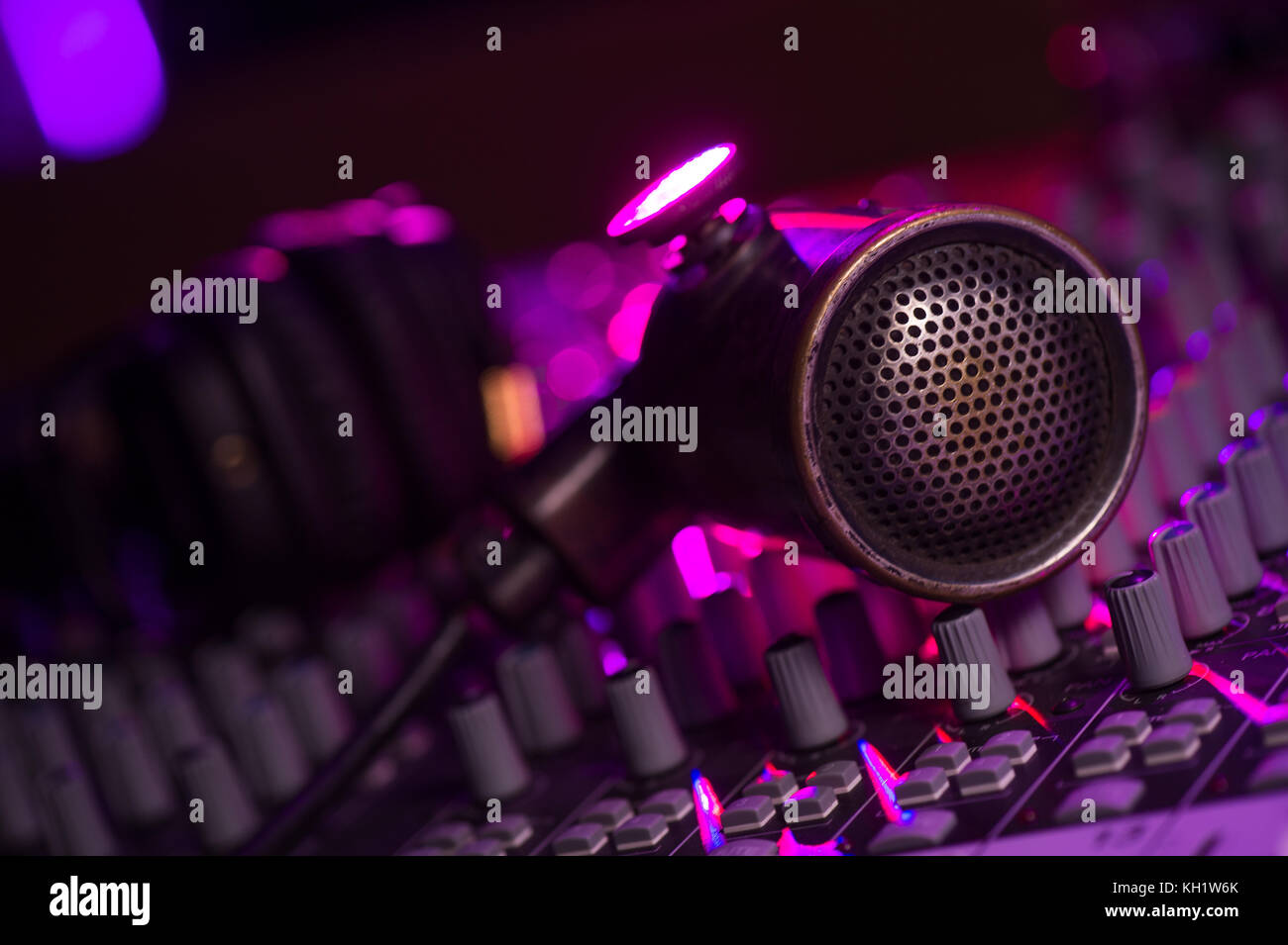 Vintage Microphone and Headphones on dirty sound mixer panel, France ...