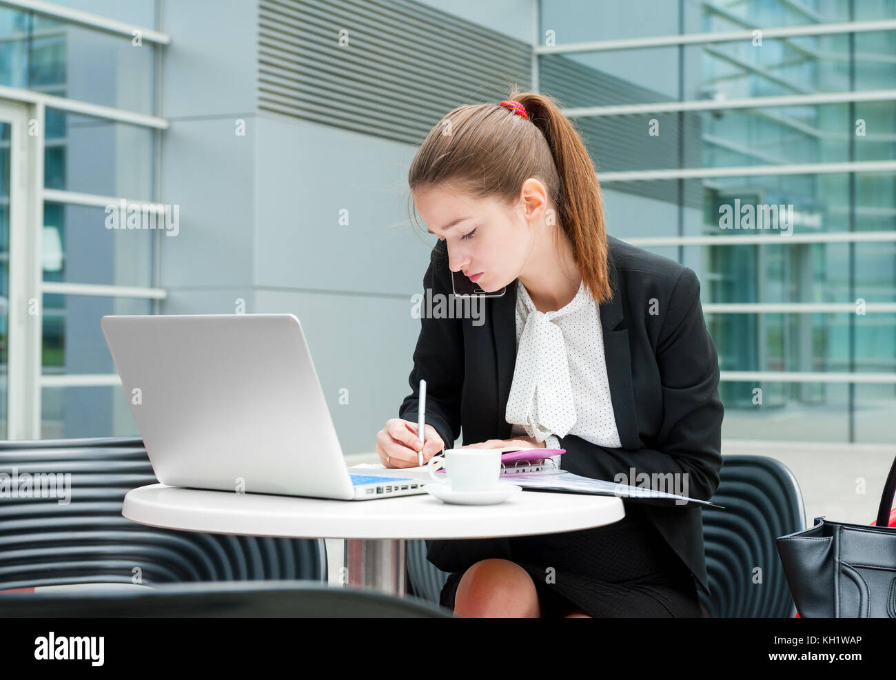 Young business woman working Stock Photo - Alamy