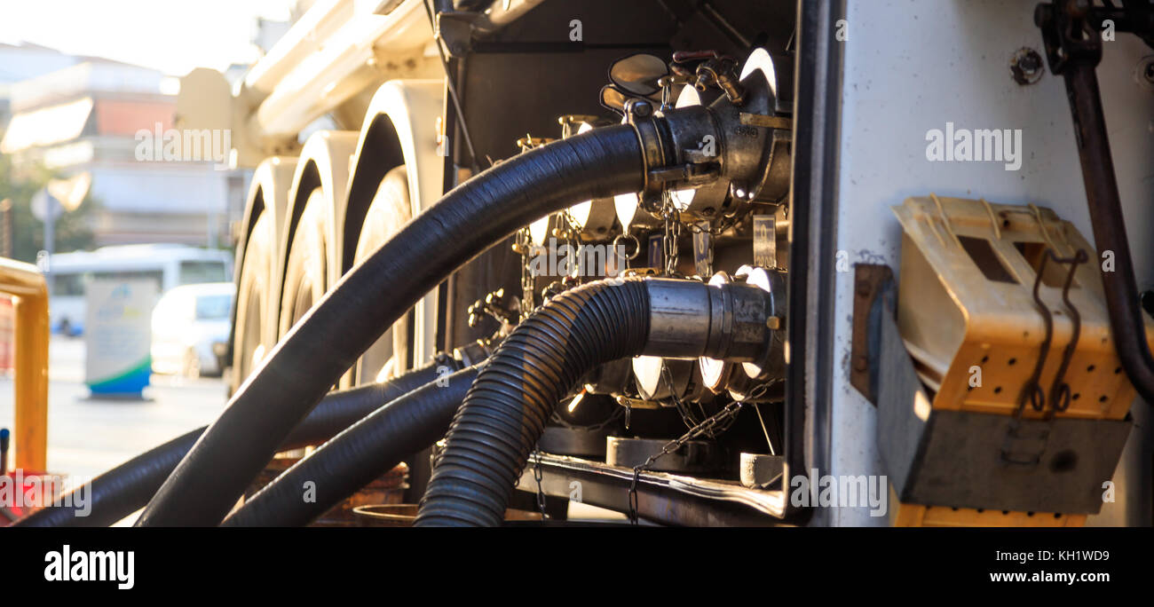 Tanker truck filling up storage tank at the fuel station Stock Photo ...
