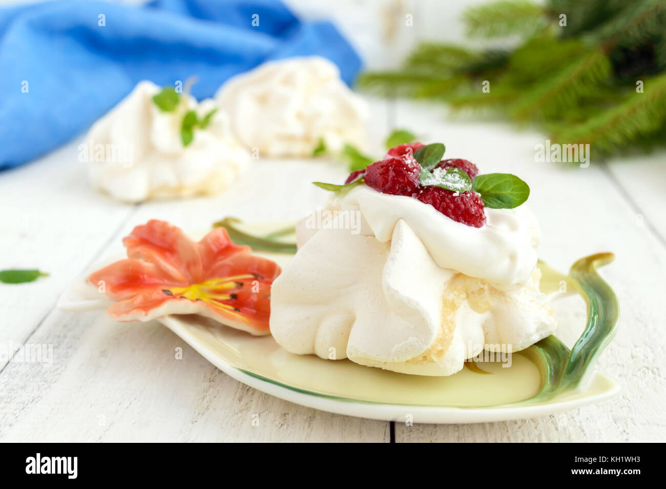 Gentle Air dessert "Anna Pavlova" with raspberries, whipped cream on a ...