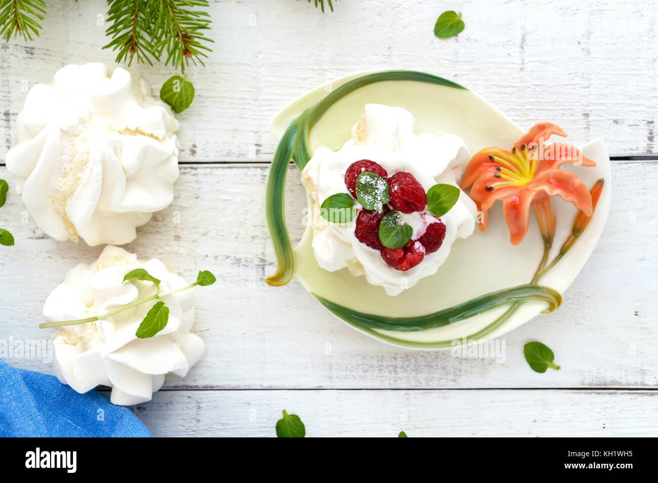 Gentle Air dessert "Anna Pavlova" with raspberries, whipped cream on a ...