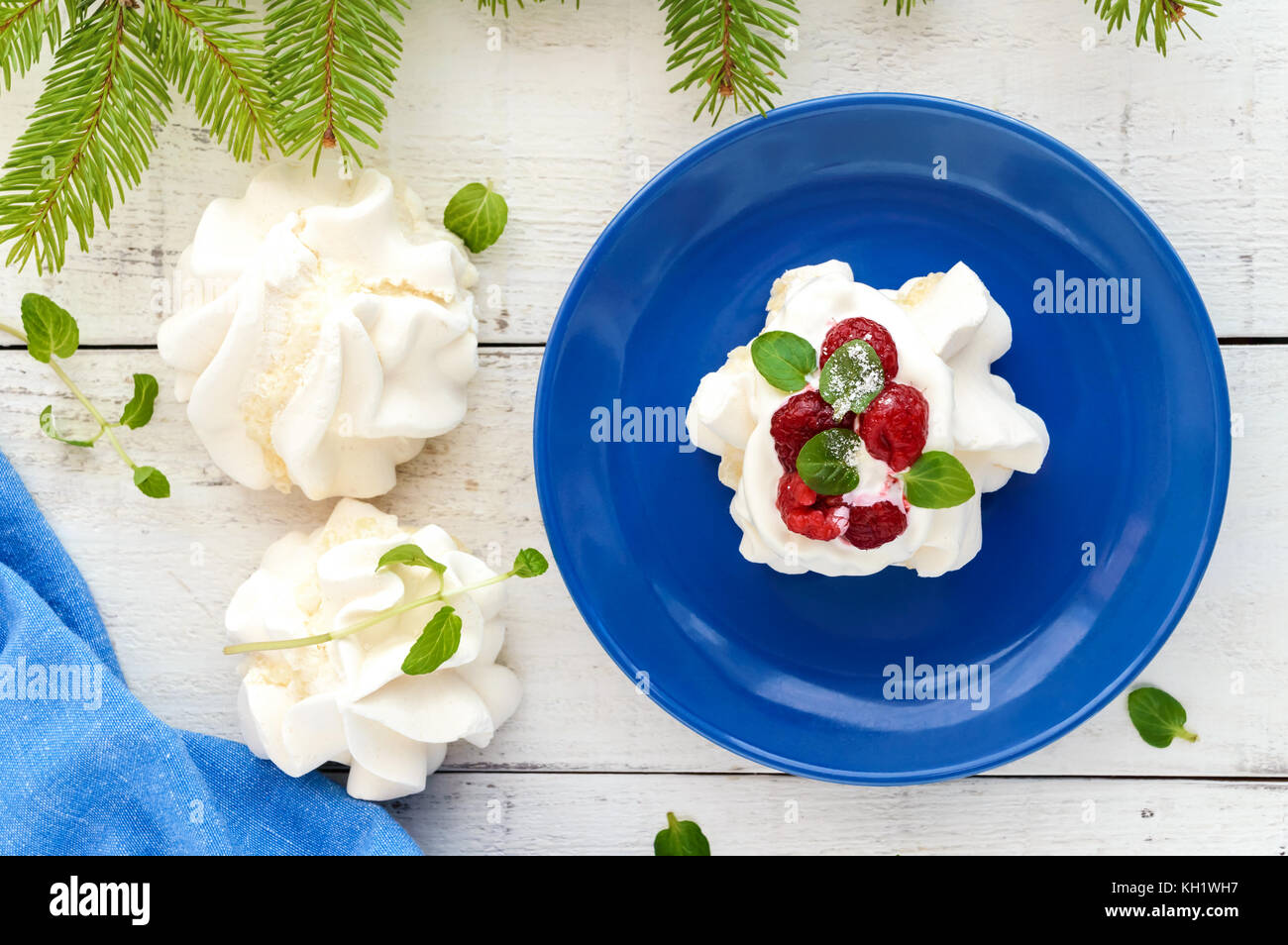 Gentle Air dessert "Anna Pavlova" with raspberries, whipped cream on a ...