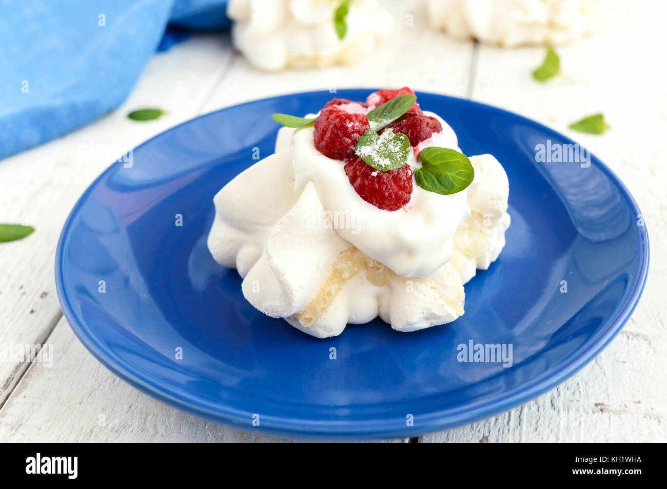 Gentle Air dessert "Anna Pavlova" with raspberries, whipped cream on a ...