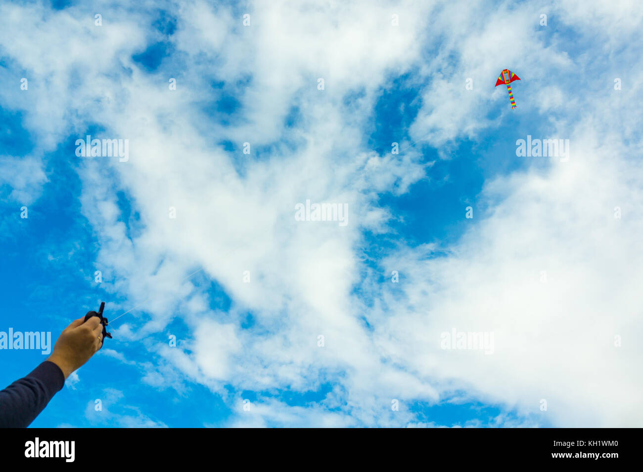Hands holding kite Stock Photo - Alamy