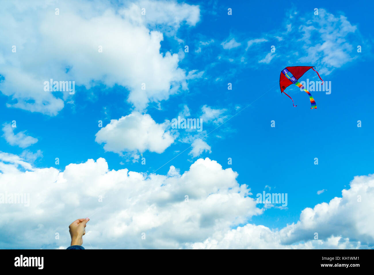 Hands holding kite Stock Photo - Alamy