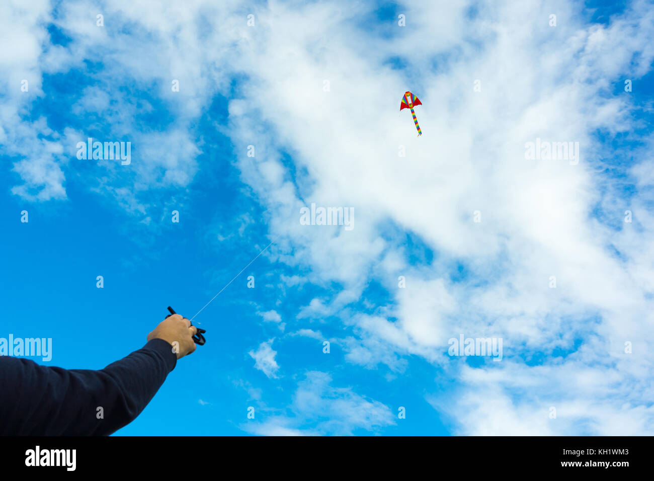 Hands holding kite Stock Photo - Alamy