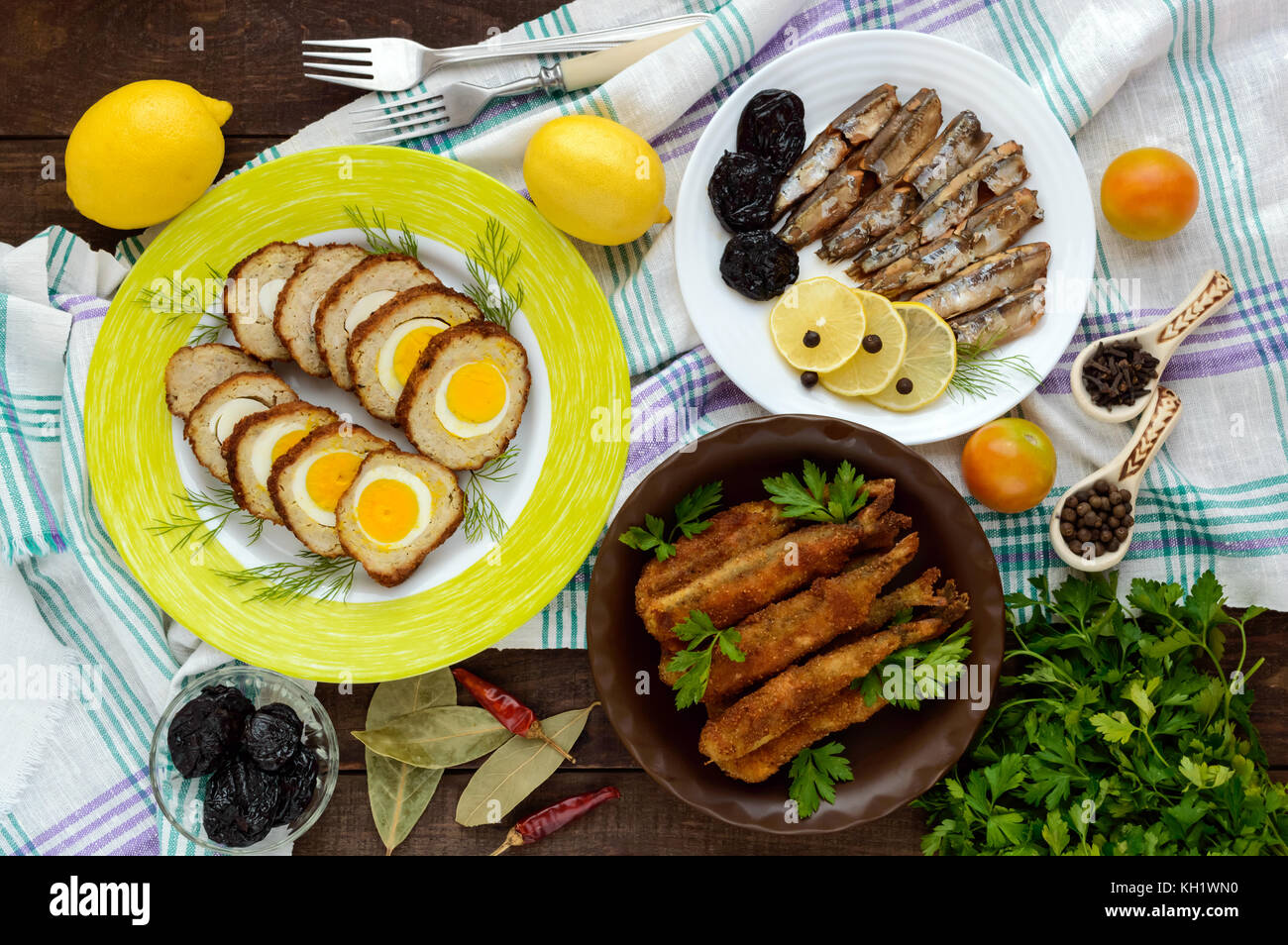 Fish dishes: White fish roll stuffed with eggs, home made sprats, fried ...