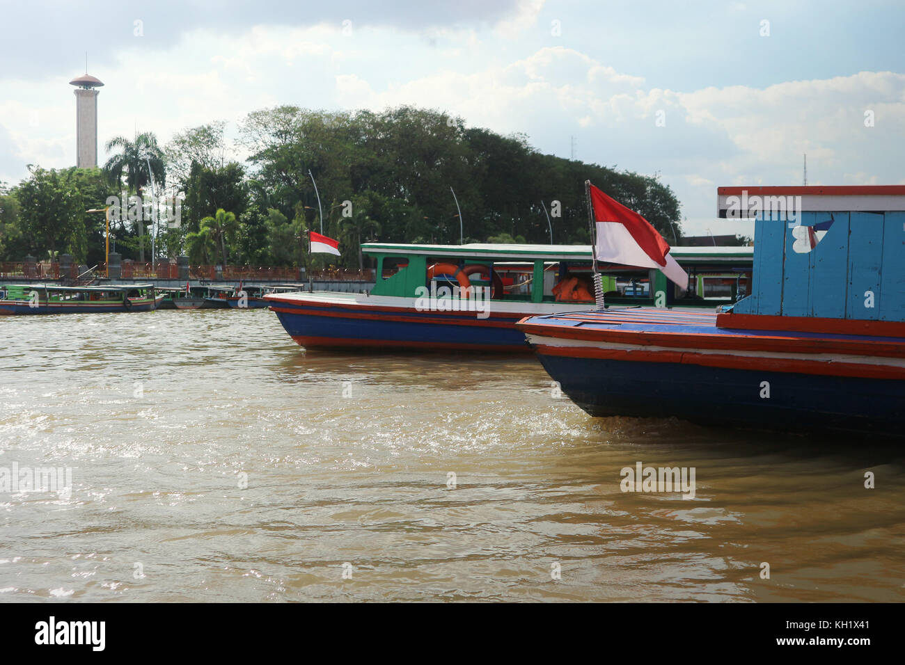 Jukung/ Sampan (traditional canoe) boats lined up in wooden deck ...