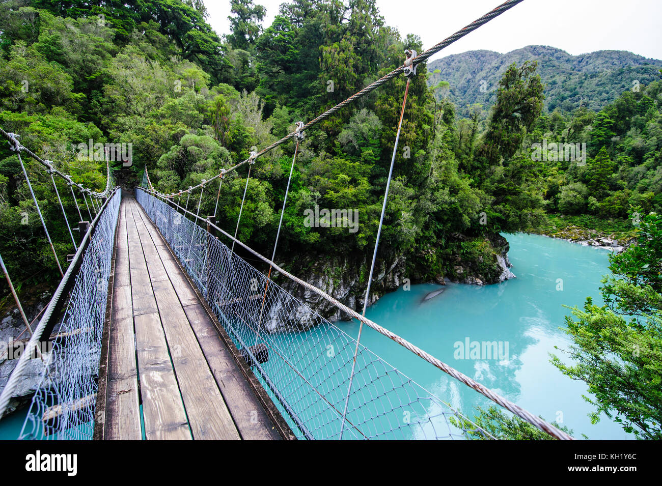 Hanging bridge above the turquoise water in the Hokitika Gorge, South ...