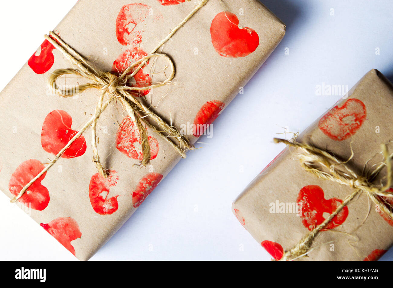 Hand packed presents on white close up Stock Photo - Alamy