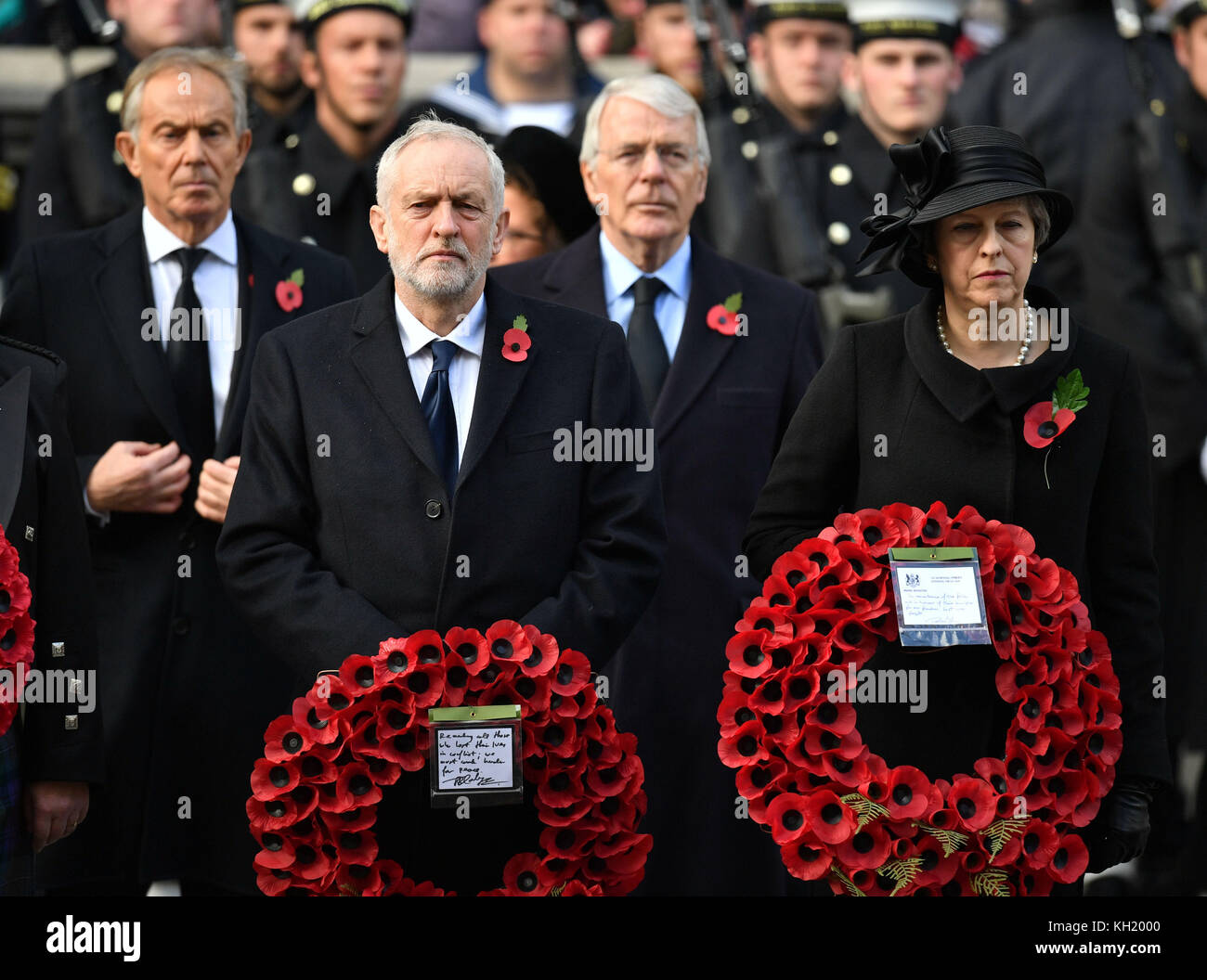 Labour leader Jeremy Corbyn stands next to Prime Minister Theresa May ...