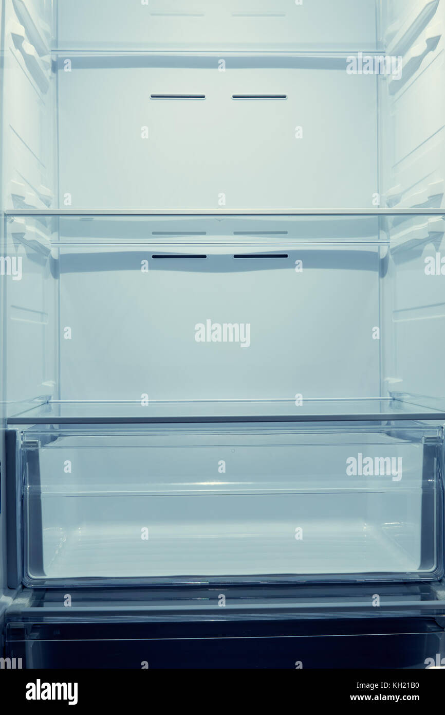 Empty shelves of a modern home refrigerator at close range Stock Photo ...