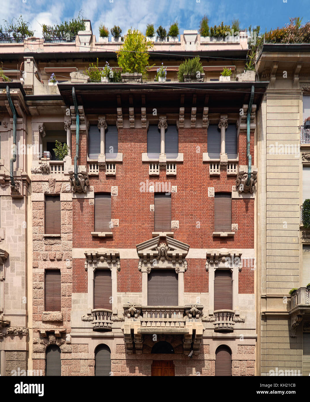 Part of the facade of one of the old buildings in Milan, Italy Stock ...