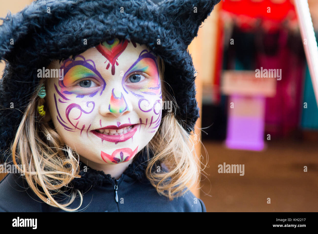 Young girl with beautiful but scary face paint Stock Photo - Alamy