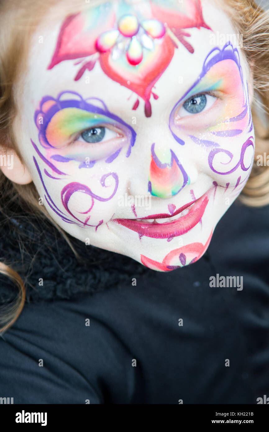 Young girl with beautiful but scary face paint Stock Photo - Alamy