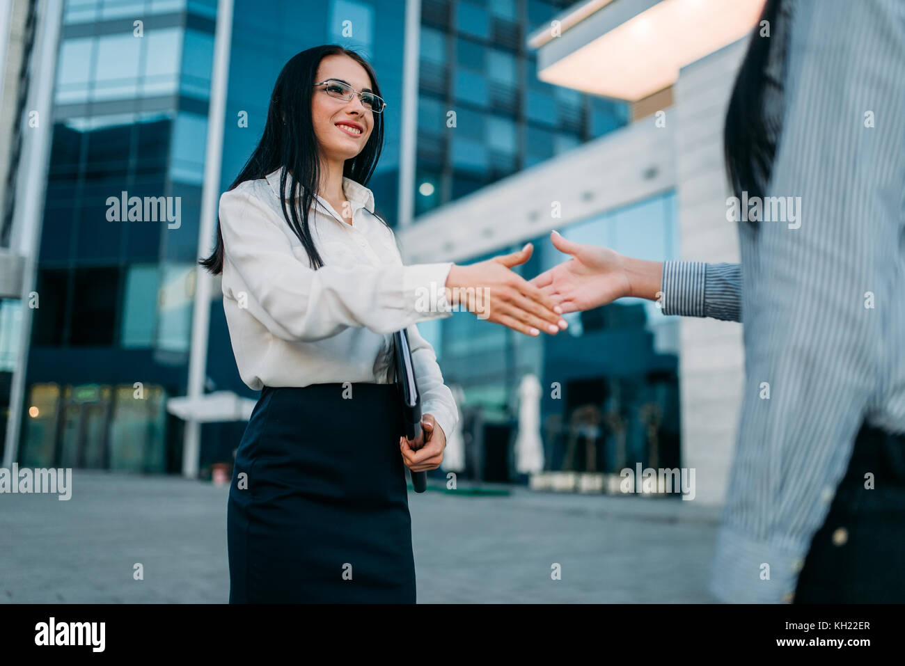 Business woman, handshake with partner outdoor Stock Photo - Alamy