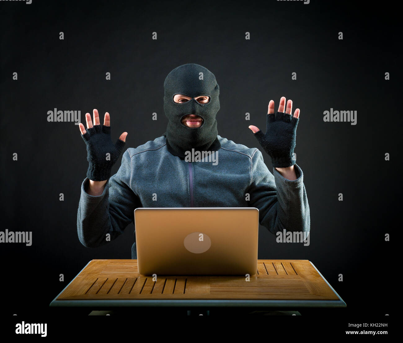 Hacker is ready to start hacking laptop Stock Photo - Alamy