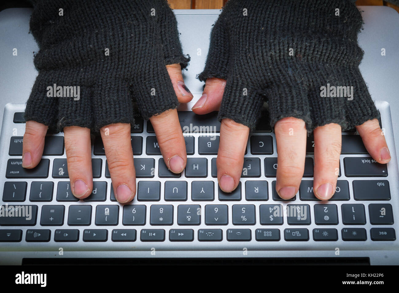 Hacker hands at keyboard gloves hi-res stock photography and images - Alamy