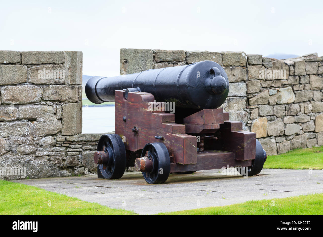 A cannon points through the rampart at Fort Charlotte. The fort ...