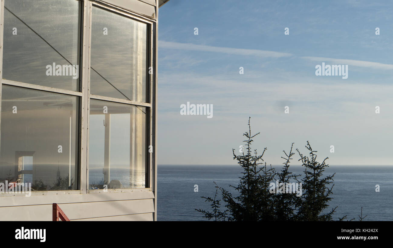 Reflection of the ocean in the evening hours in the window of the ...