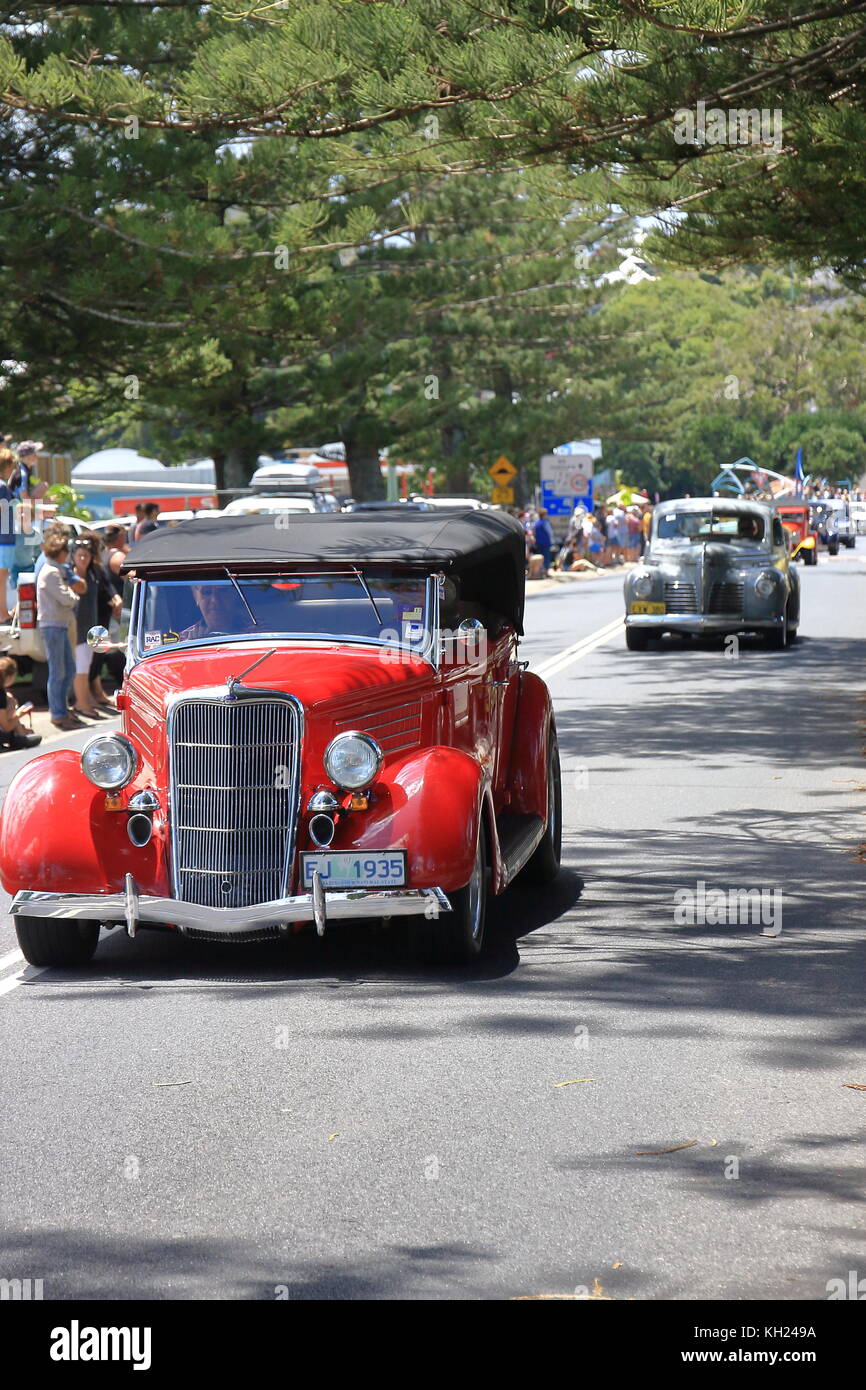 A restored red Studebaker leads the parade along Yambas annual hot rod ...