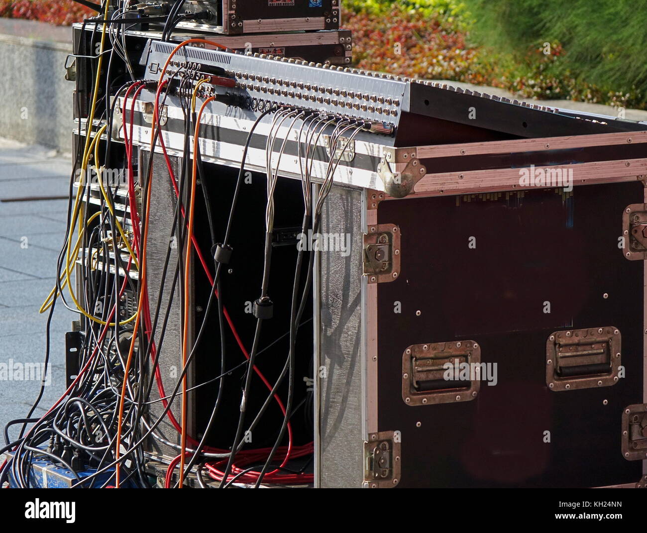 A large audio mixer console with a multitude of cables attached Stock ...